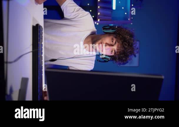 Arabic guy gamer talking with headphones and a microphone to an online ...
