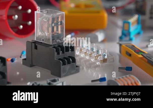 Yellow multimeter and relay with electromagnetic coils of direct and ...