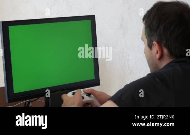 Young male gamer playing game console using joystick remote control ...