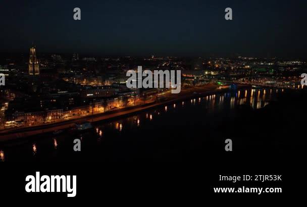 Arnhem city in the Netherlands by night Aerial drone. City center ...