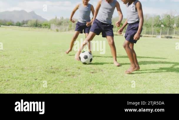 Video of three happy african american schoolchildren playing football ...