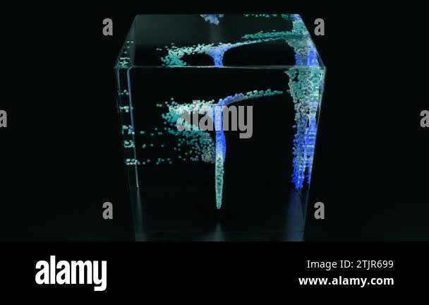 Particles swirl around inside a glass cube. 4K UHD animation Stock ...