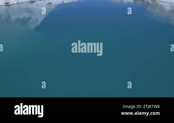 Aerial establishing shot of beautiful blue Tilicho lake in high ...