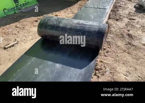 Roll waterproofing of the foundation of the building before the start ...