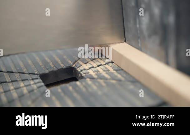 Working with raw wood materials in workshop, workman cutting thin wood ...