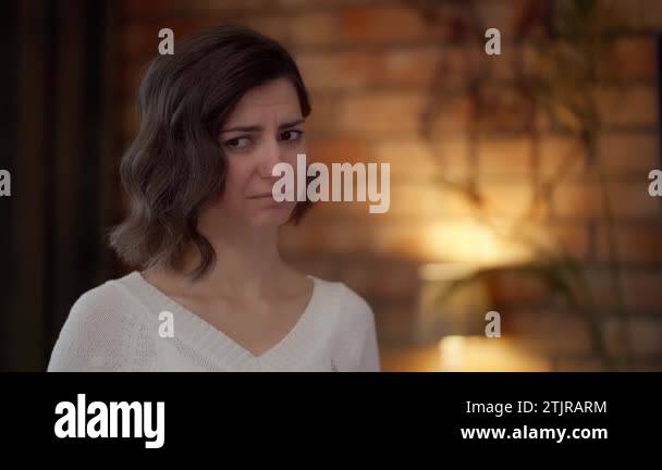 A frustrated and disappointed young woman is depressed, offended and ...