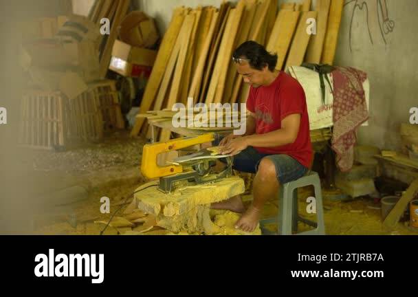 Professional artisans are making traditional Javanese wooden dolls ...