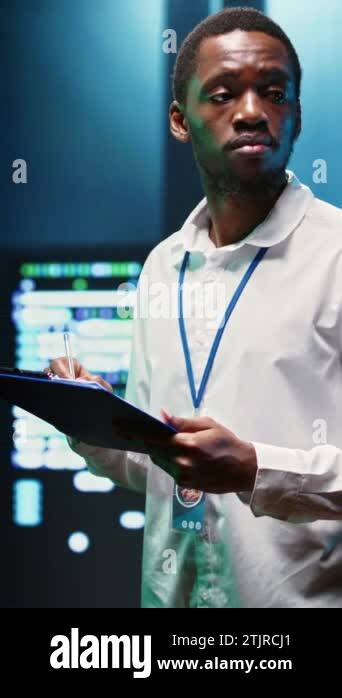 Technician checking server racks Stock Videos & Footage - HD and 4K Video Clips - Alamy