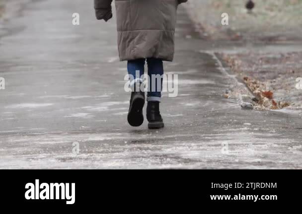 girl goes to school on a slippery icy path,bad weather Stock Video ...