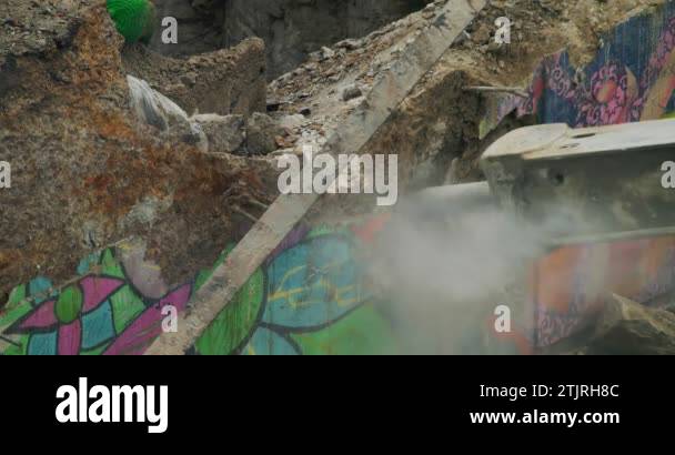 Excavator removing debris of collapsed structure. Shot in 4K RAW on a ...
