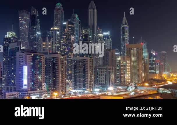 Dubai marina tallest block of skyscrapers during all night timelapse ...