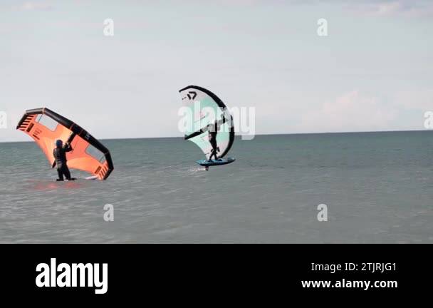 Modern water sport. Hydrofoil ride on the ocean using the wing and the ...