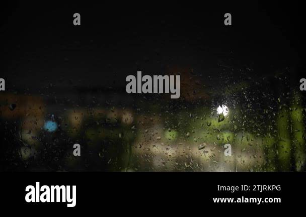 Rain. Rain in the night. Light rainfall. Close-up of rainfall. Puddle ...