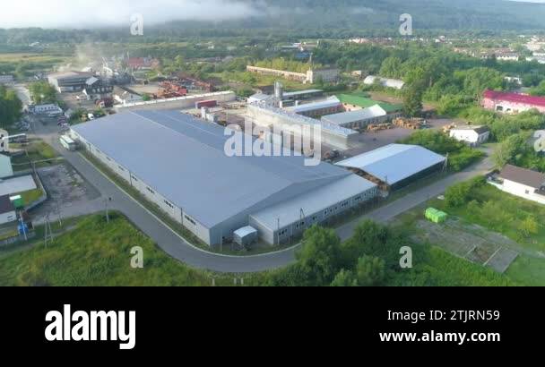 Modern factory top view. A flight over a new modern furniture factory ...