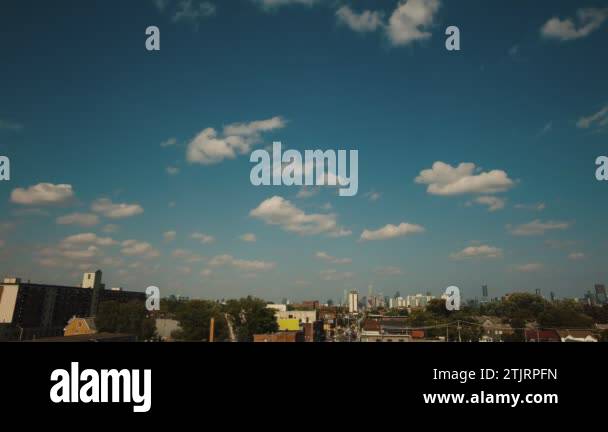 Extreme ultra wide view of Bloor Street in Toronto on a day with puffy ...