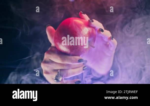 Woman as witch offers red apple as symbol of temptation, poison. Fairy ...