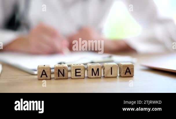 Therapist doctor writes medical diagnosis of anemia. Anemia treatment ...