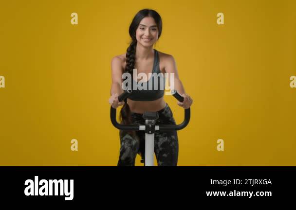 Girl exercise bike fitness health woman slim cycling Stock Videos ...