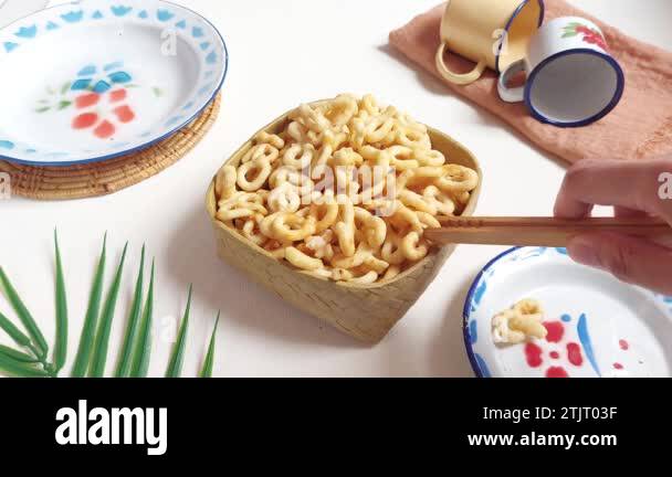 Woman hand takes Lanting. Lanting is indonesian traditional snack. Made ...