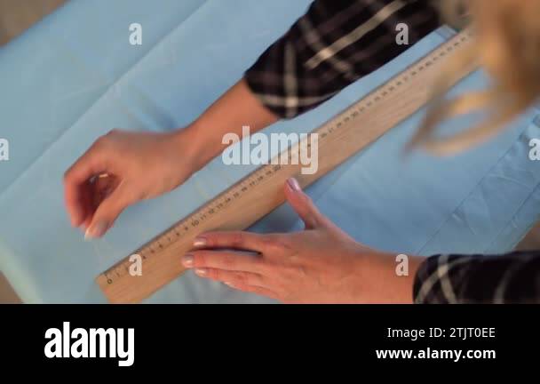 Beautiful fashion designer drawing on fabric, hand making clothes in ...