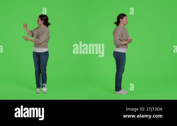 Young adult doing advertisement and example sign on camera, standing ...