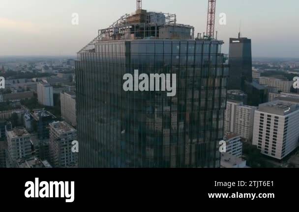 Reveal of the dusk sky and the city reflection on the high rise ...