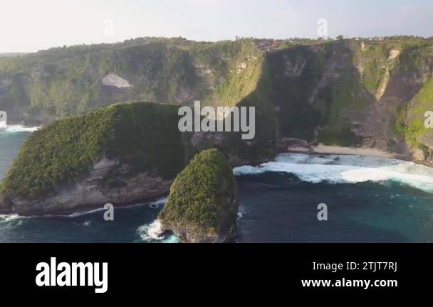 Dramatic aerial drone footage of the famous Kelingking beach, aka T Rex ...