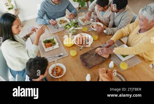 Food, big family and eating together from above, generations in dining ...