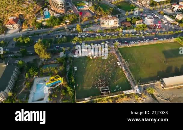 Young people holding hands up, relaxing at outdoor party, having fun ...