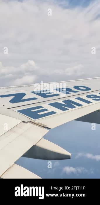 Vertical view of a commercial aircraft wing with zero emissions on it ...