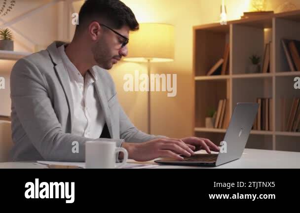 Online work. Busy man. Digital technology. Serious guy in classic suit ...