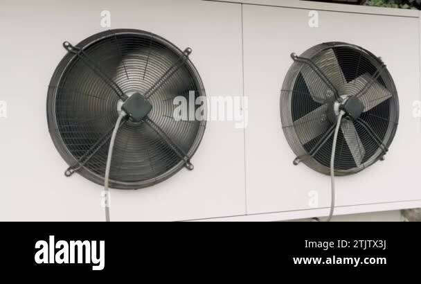Industrial air conditioning system. Large fans on the wall of the ...