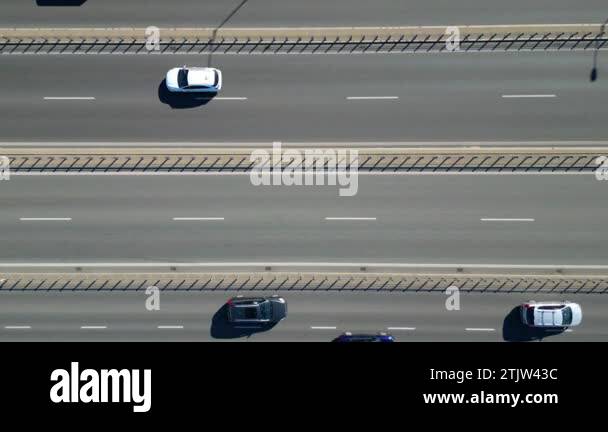 Aerial Drone Flight top down View of freeway busy city rush hour heavy ...