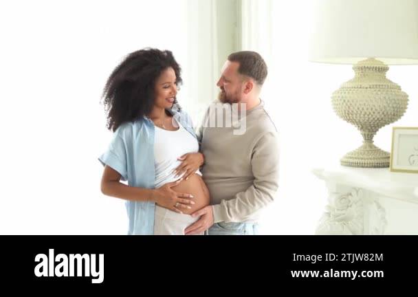 White Man Touching Belly Of His Pregnant Black Wife Pregnant Woman And
