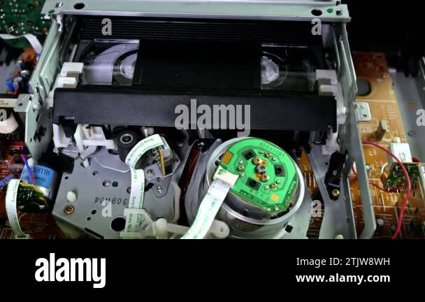 Inserting a VHS Tape into a VCR Player and showing how it works Stock ...