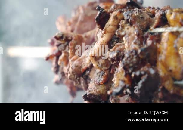 Homemade marinated and seasoned meat tenderloin slowly rotating on ...