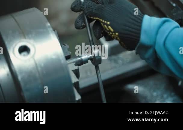 Tapping threads in stainless steel using a hand tap.Turning lathe in ...