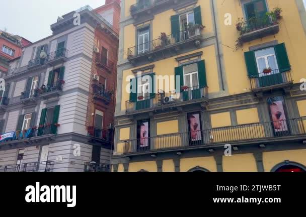 Via dei Tribunali central busy street in Napoli old town. Italian ...