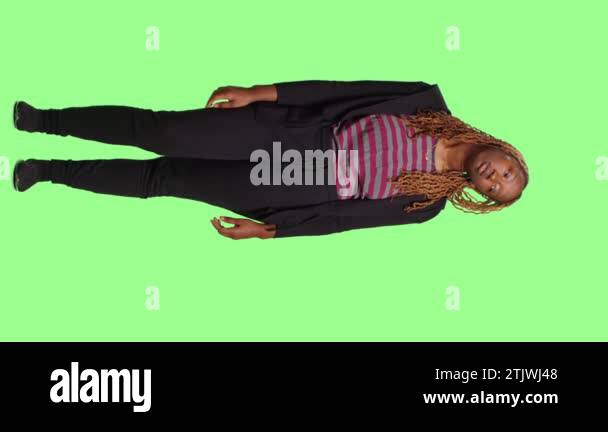 Vertical video: African american woman standing with full body on ...