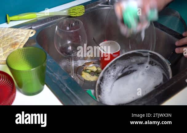 mess and dirt in the house - kitchen sink with dishes and utensils that ...