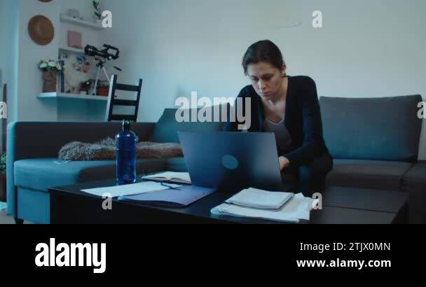 Mother Freelancer Sit On Sofa Work At Home With Computer Son Interrupts