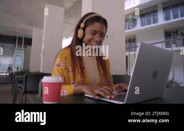 Young black African woman university student learning online using ...