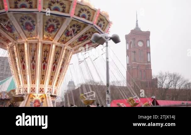 Chain carousel, amusement park, people ride. An enthusiastic smiling ...