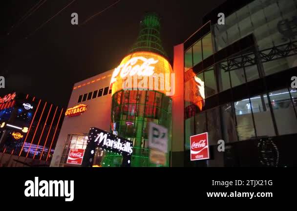 Driving on Las Vegas Strip at Night. Glowing Coca Cola Logo and Bottle ...