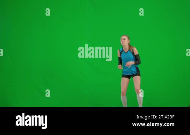 Young woman bouncing, batting ball and falling on the floor. Athlete ...