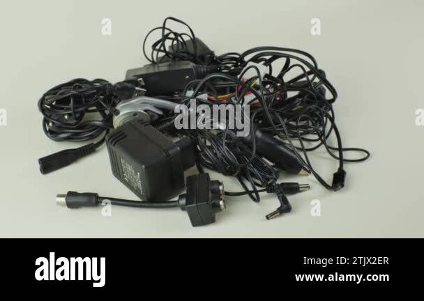 Bunch of old wires, connections and chargers for modern devices close ...