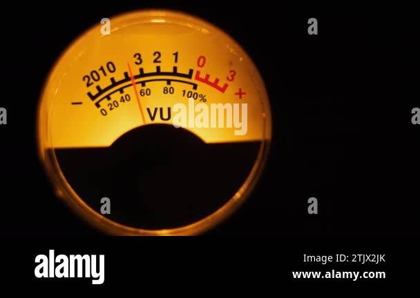 Analog dial indicator of audio signal level. Vintage arrow moves in ...