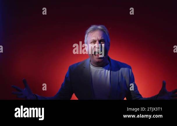 Work stress. Desperate aged man. Neon light portrait. Angry business ...