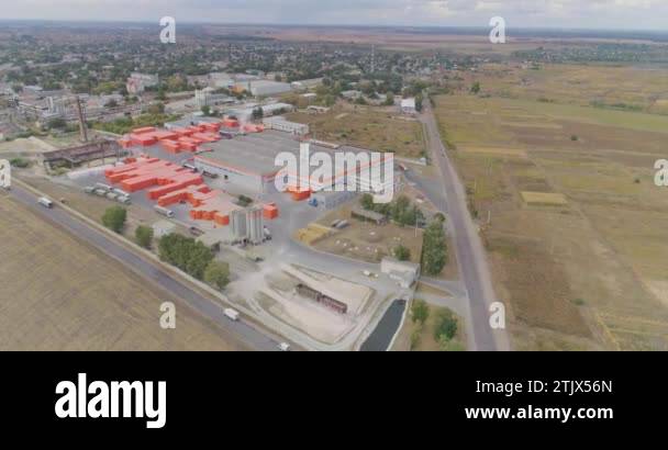 Modern factory top view, flying around a new modern factory in orange ...