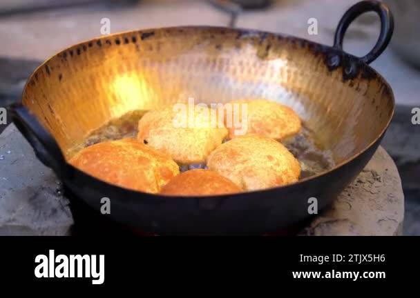 Making of delicious Bengali Luchi (deep fried bread). This is another ...